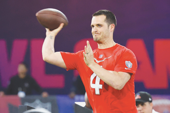 1st big domino falls in NFL quarterback chase as Derek Carr signs with ...